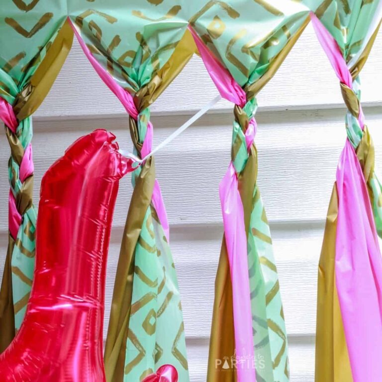 DIY Braided Plastic Tablecloth Party Backdrop
