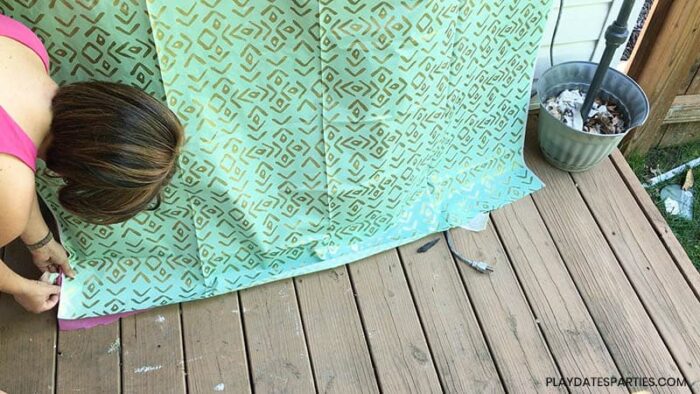 DIY Braided Plastic Tablecloth Party Backdrop